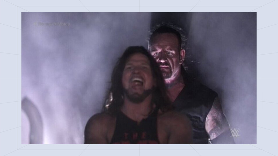 Undertaker Standing Behind AJ Styles Menacingly - AI Memes Template